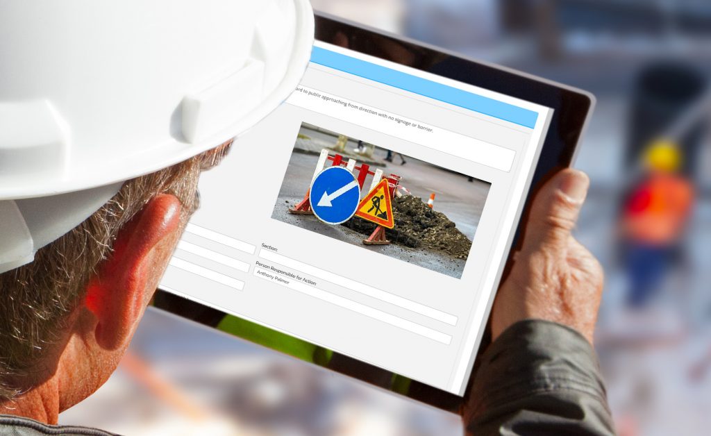 Man filling out form at construction site | BIS Safety SoftwareBIS ...