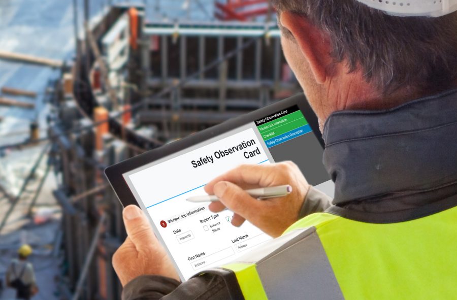 Worker using a safety checklist card | BIS Safety Software