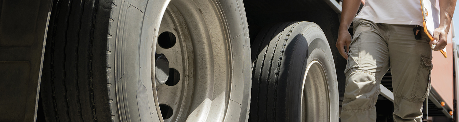 truck inspection and safety, truck driver walking around a semi truck ...
