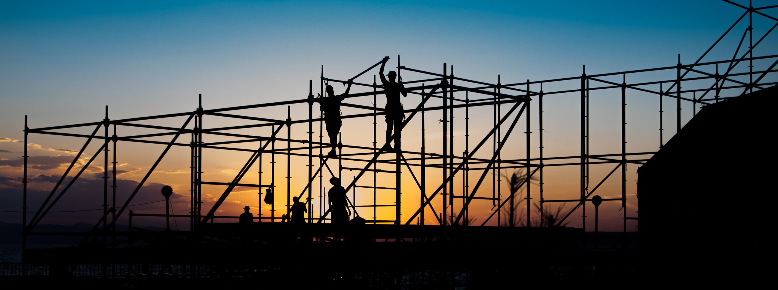 Construction workers working on scaffolding. | BIS Safety Software