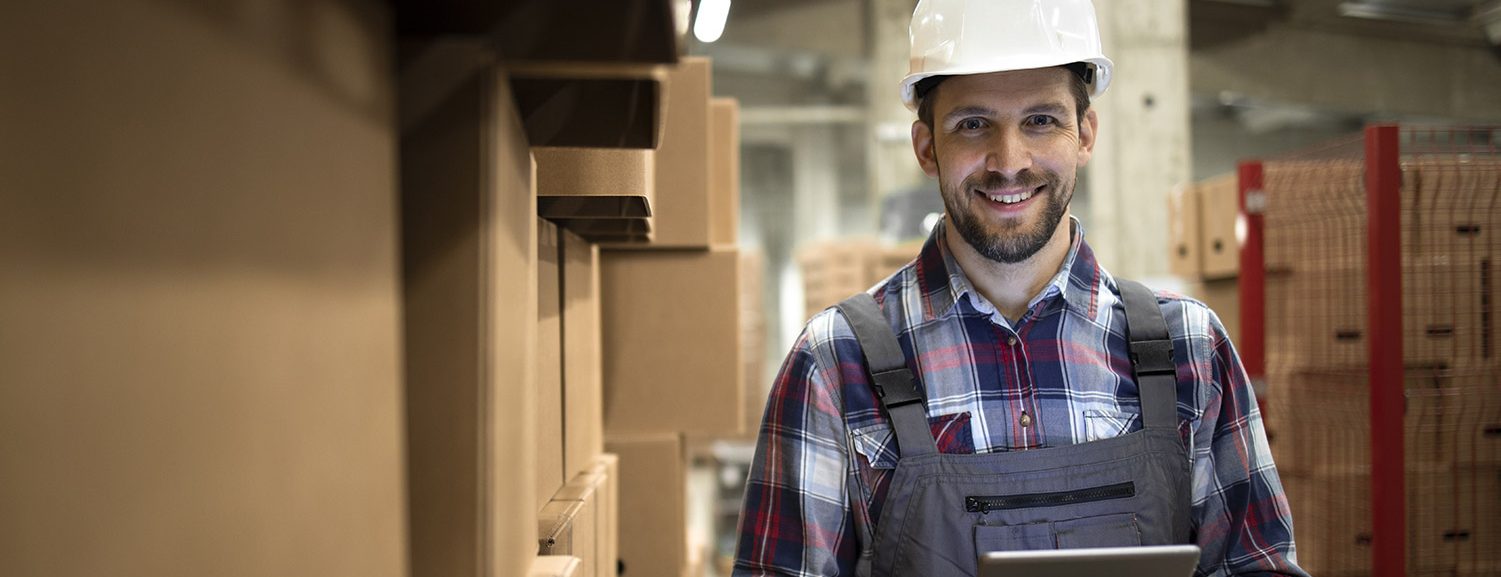 warehouse supervisor holding tablet computer | BIS Safety Software